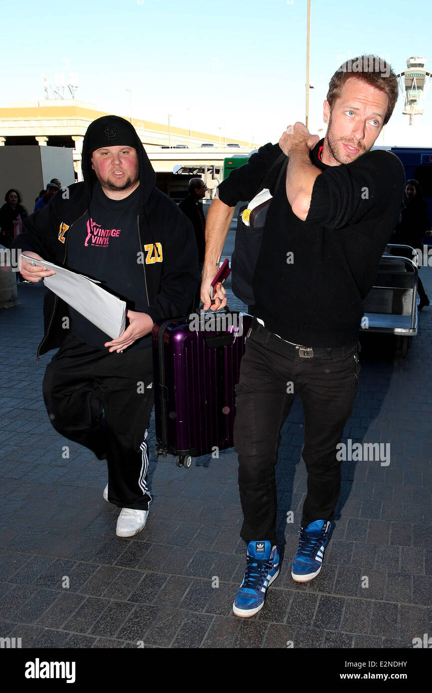 Coldplay frontman Chris Martin in good spirits as he arrives at LAX ...
