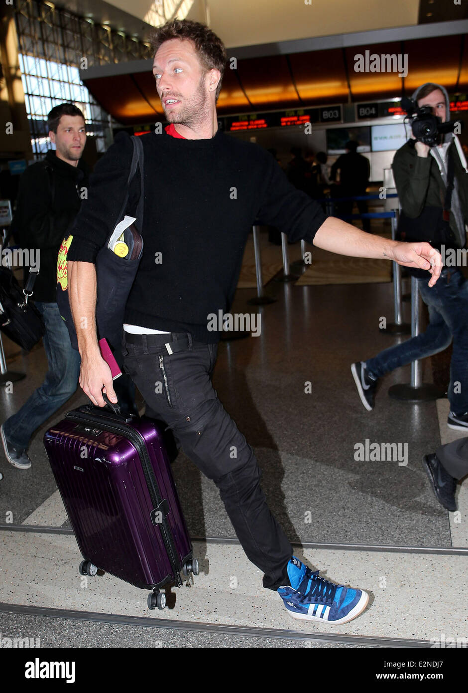 Coldplay frontman in good spirits as he arrives at LAX airport ...
