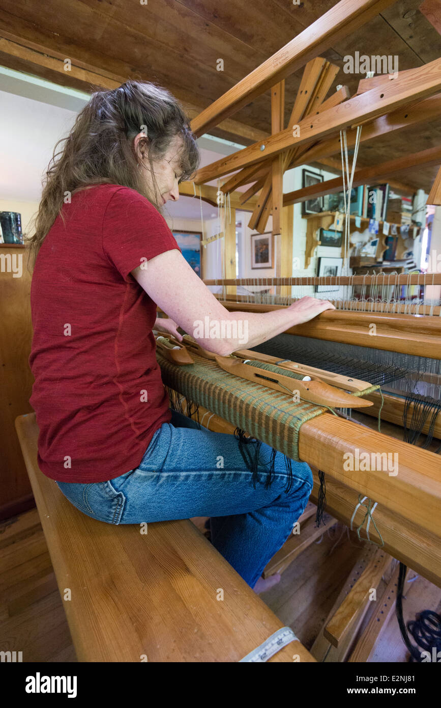 Fiber artist weaving on a loom, Oregon Stock Photo - Alamy