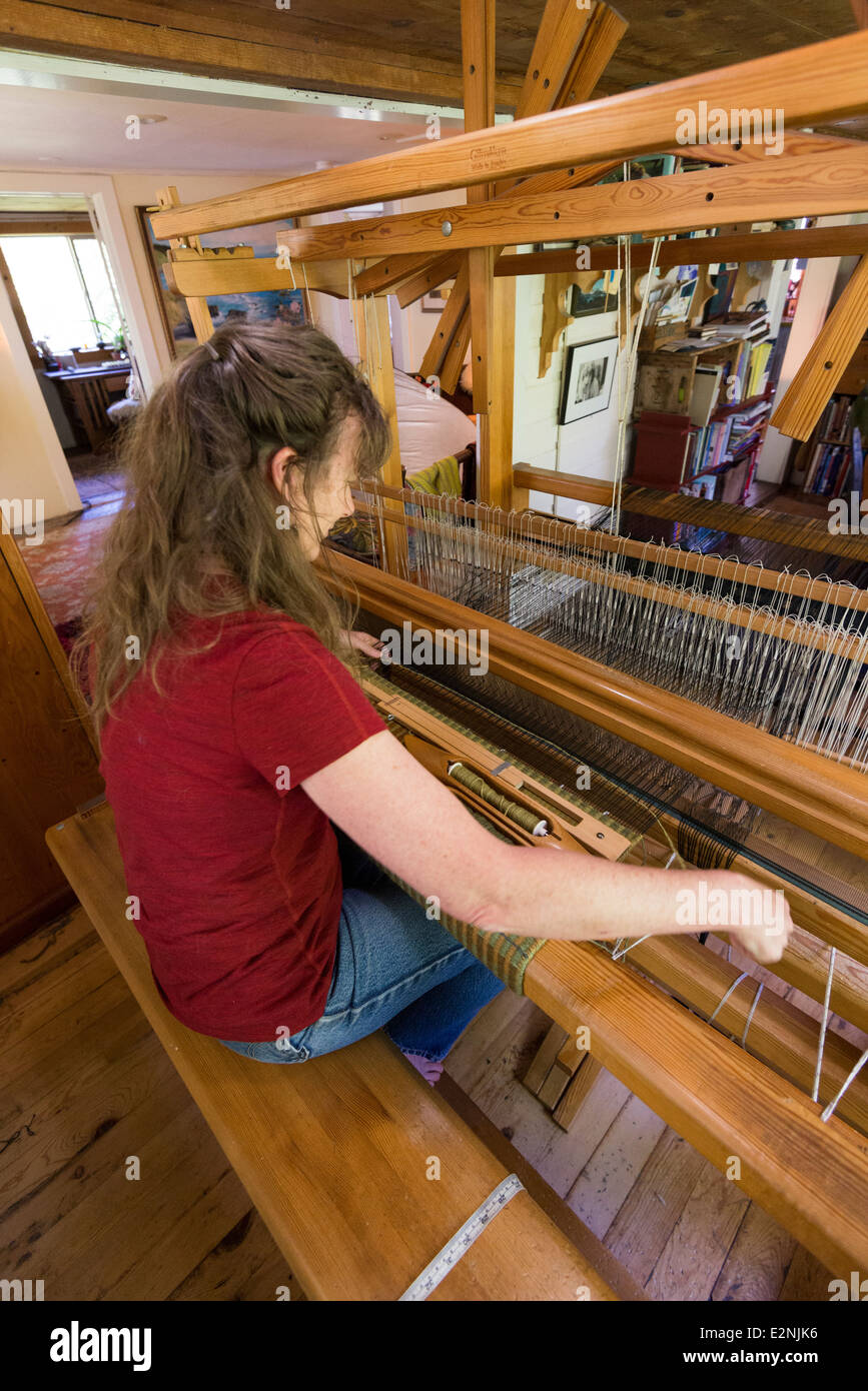 Fiber artist weaving on a loom, Oregon Stock Photo - Alamy