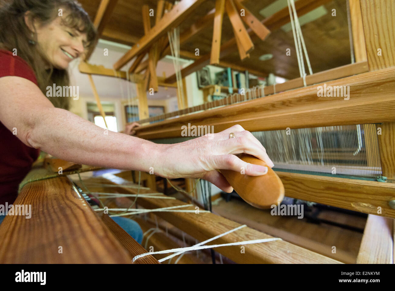 Fiber artist weaving on a loom, Oregon Stock Photo - Alamy