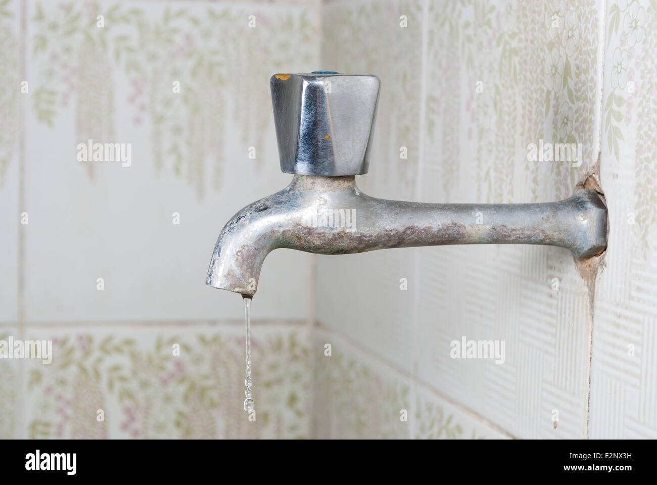 Rusty Water Tap with Water Drop Stock Photo - Alamy
