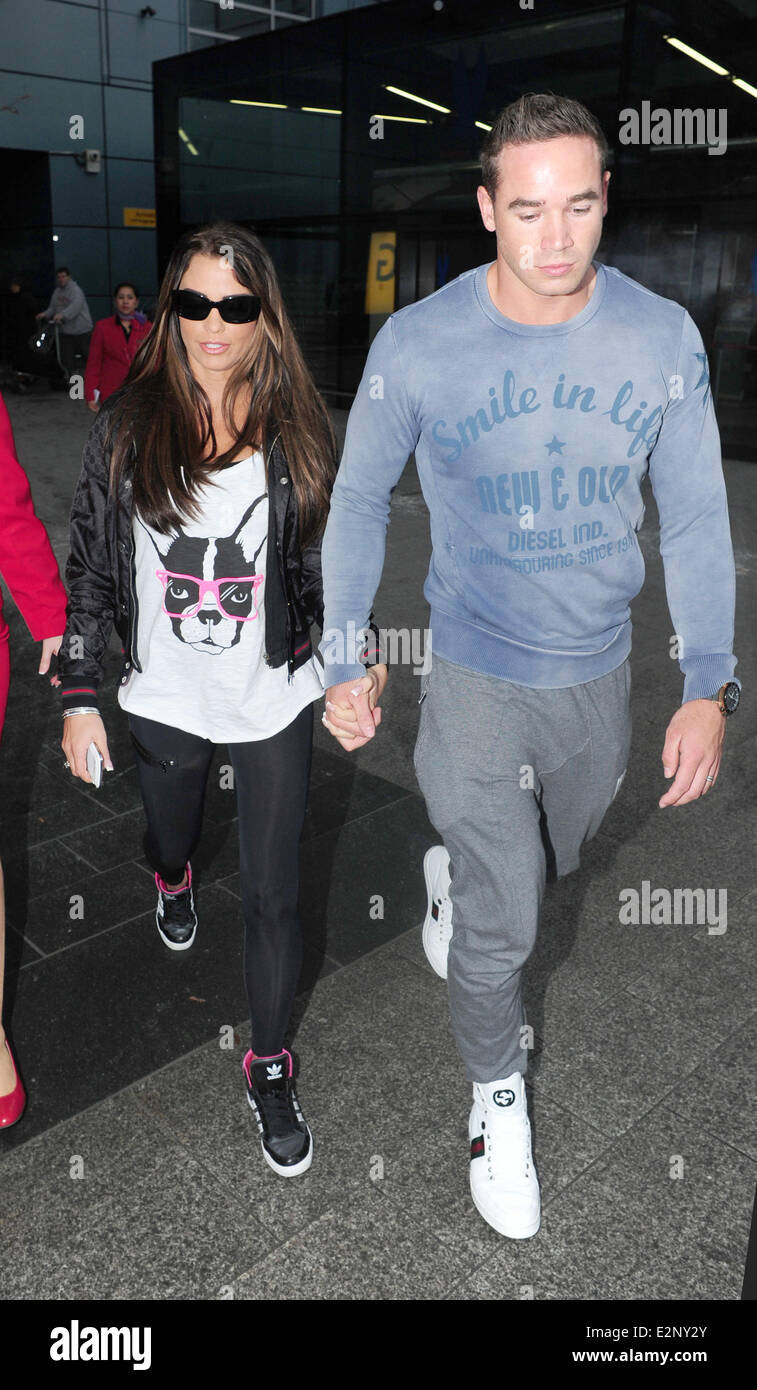 Katie Price and new husband Kieran Hayler arrive at Heathrow airport ...