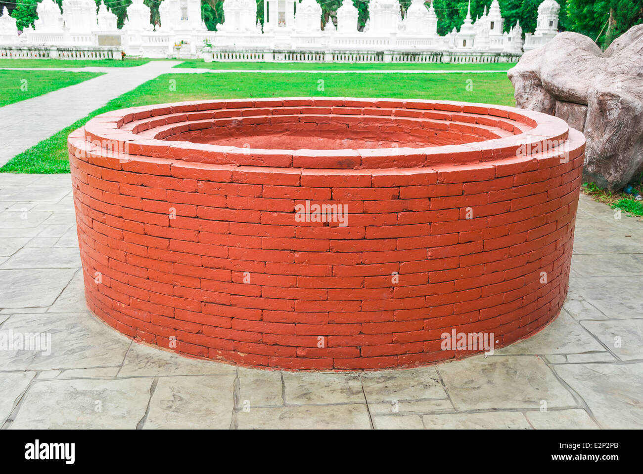 Brick Well in front of Ossuaries in Temple Stock Photo - Alamy