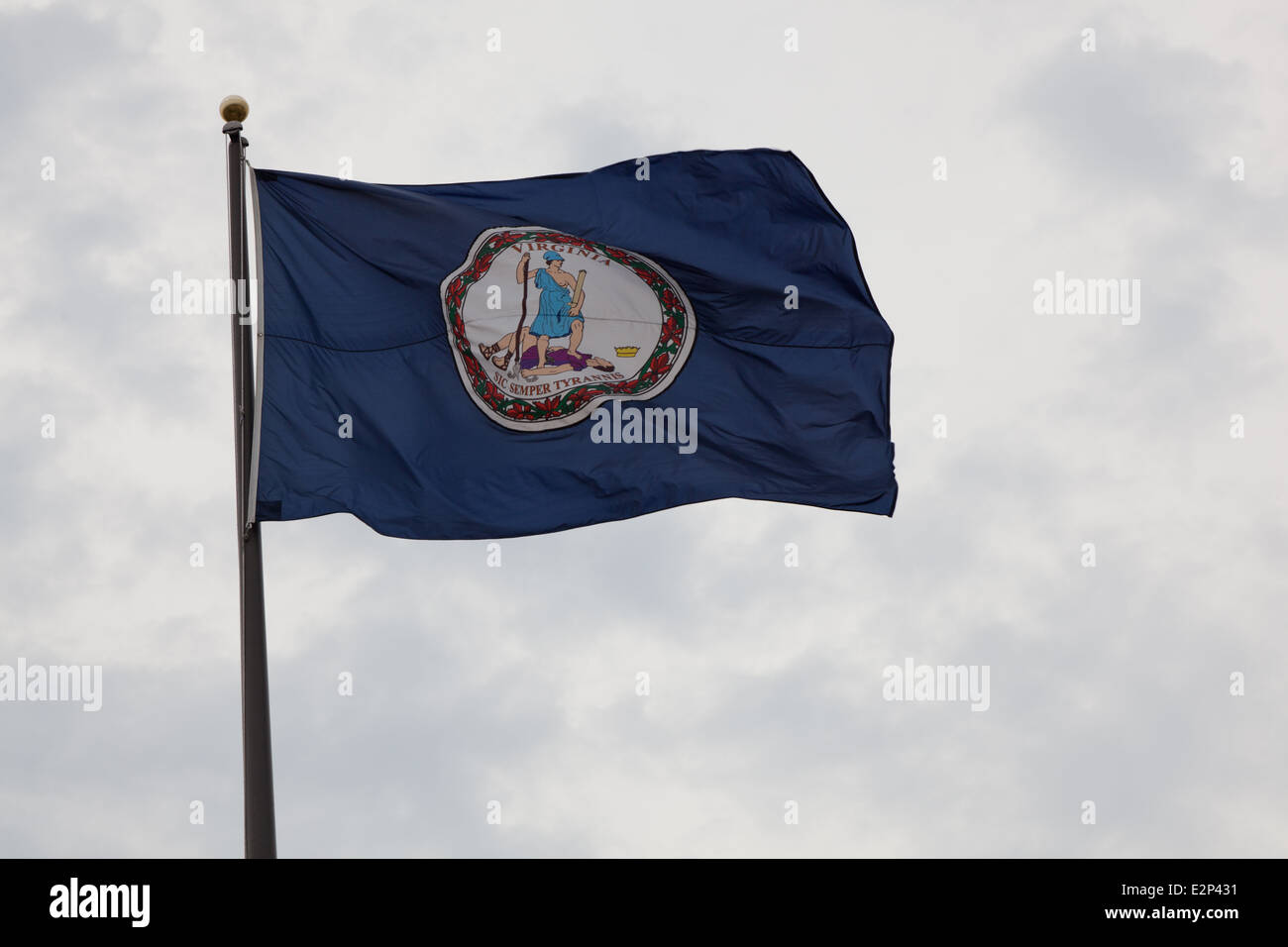 Virginia flag flying in cloudy sky Stock Photo - Alamy