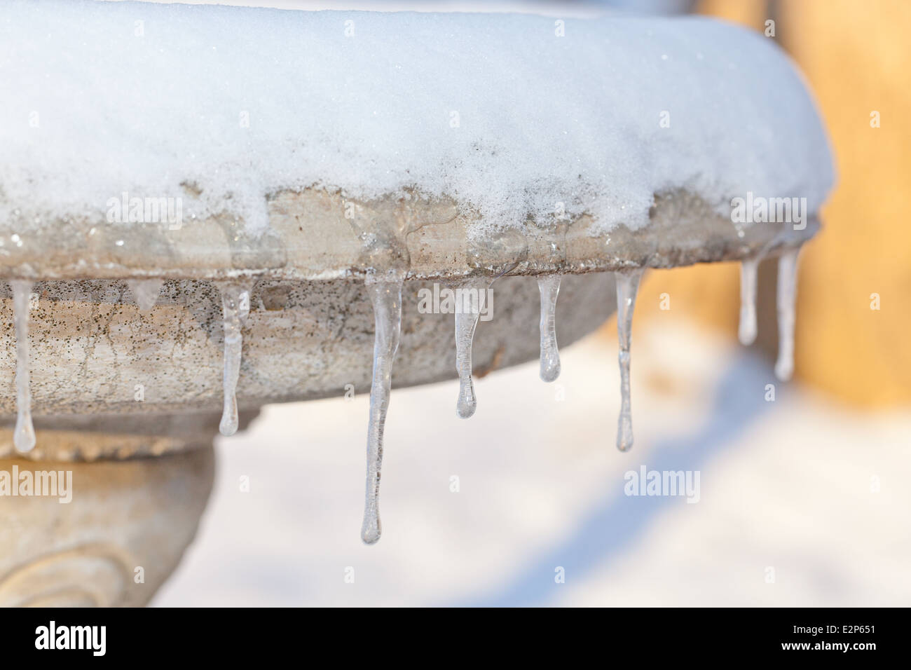 Frozen drips falling from a birdbath Stock Photo - Alamy