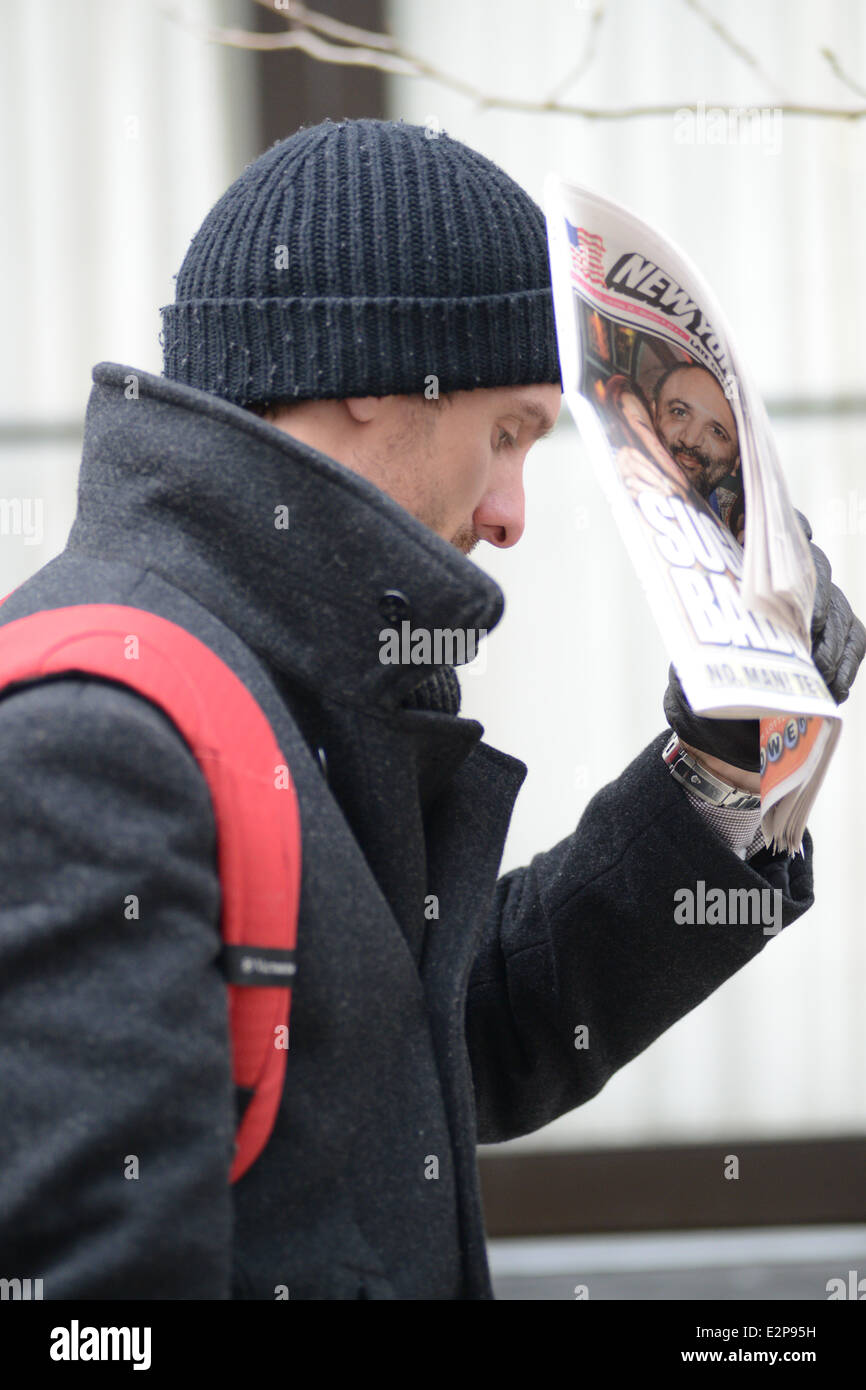 Jason Hoppy shields his face with The New York Post while out and about ...