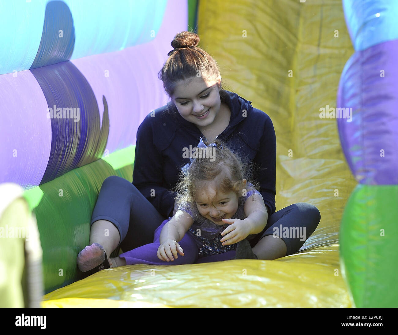 Ariel Winter enjoys an ice cold drink and playing on the bouncy castle ...
