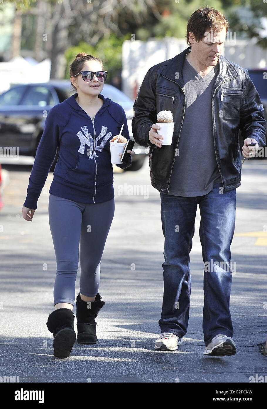 Ariel Winter enjoys an ice cold drink and playing on the bouncy castle ...