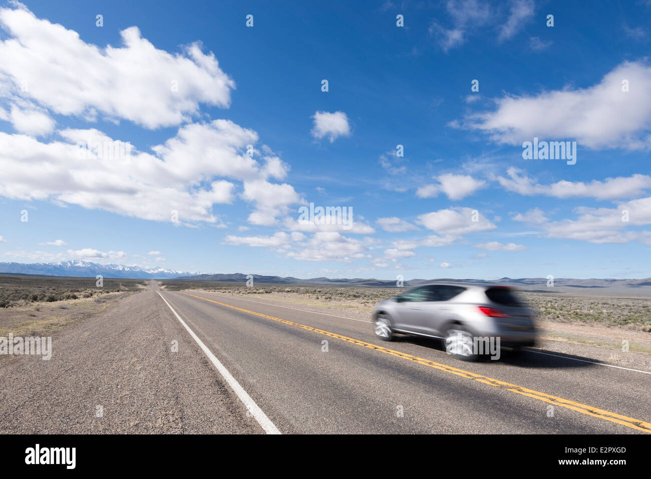 Car on a desert highway below the Toiyabe Range, Nevada Stock Photo - Alamy