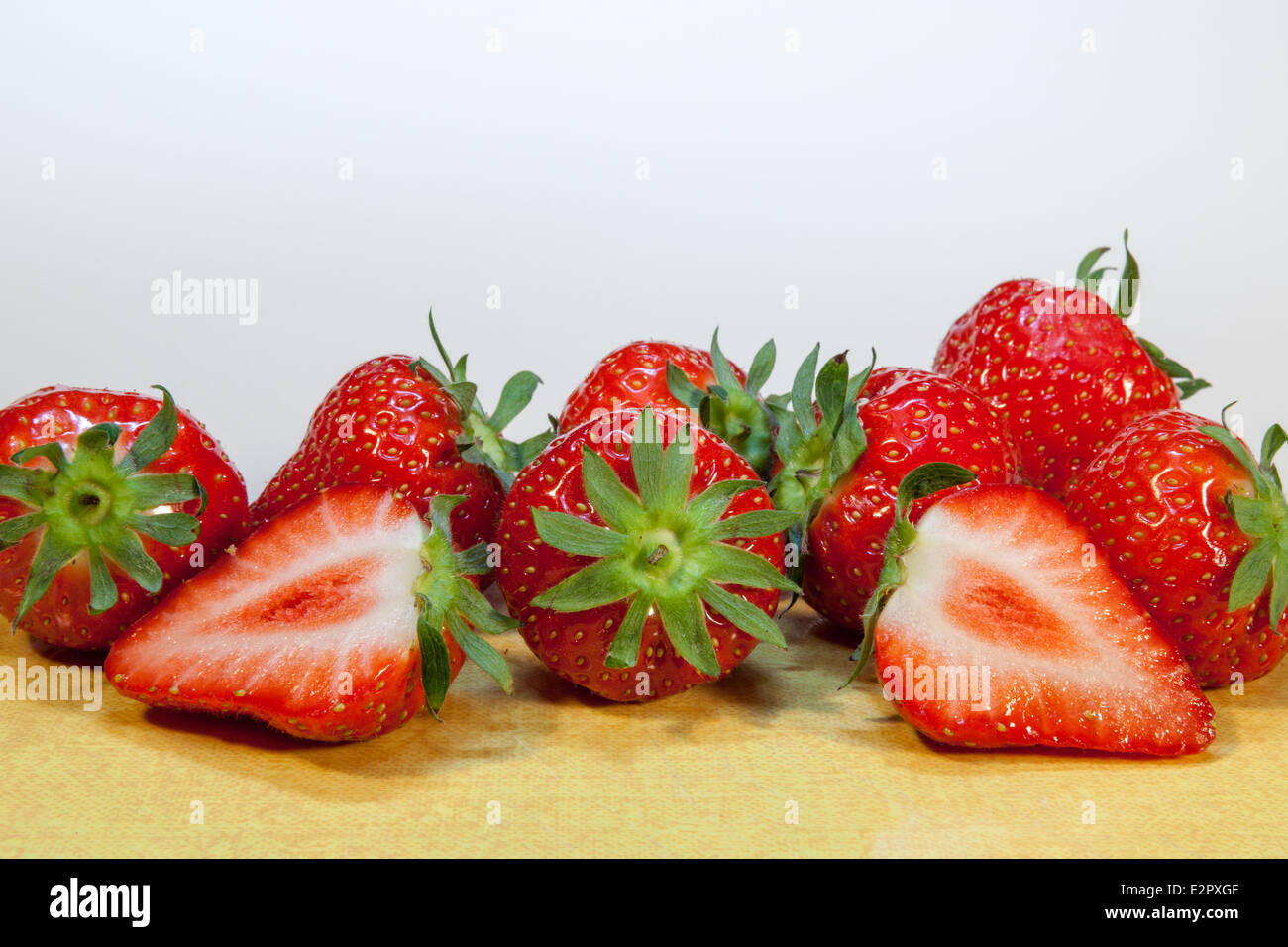 this strawberries lightly shelf on the table Stock Photo - Alamy
