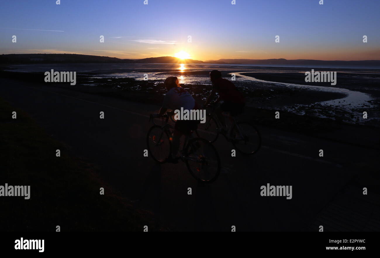 Swansea, UK. Saturday 21 June 2014 Pictured: Two cyclists ride on the ...