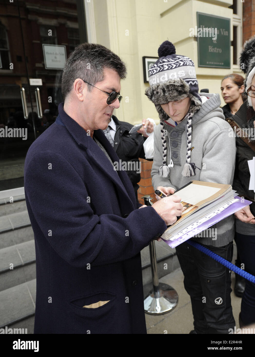 Judges sign autographs for waiting fans as they leave their hotel ...
