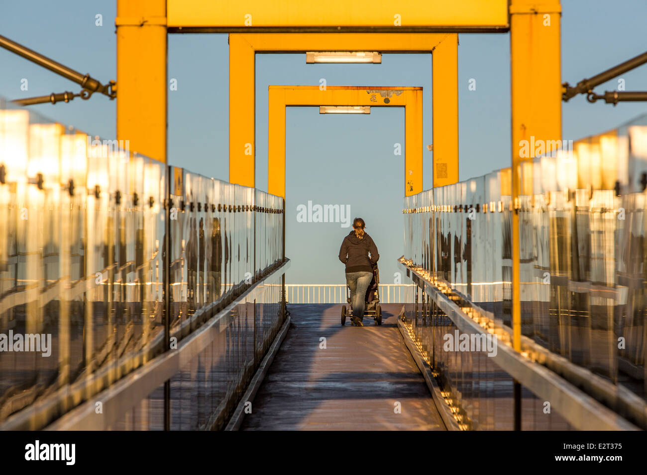 Pedestrian ramp. Young woman with baby stroller Stock Photo - Alamy