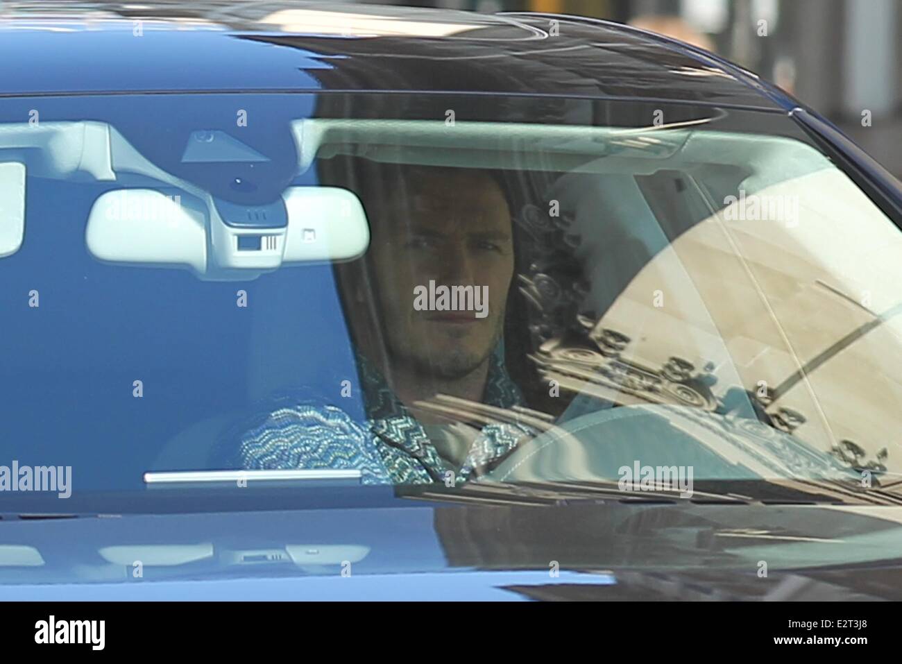 David Beckham seen driving around Paris in his Audi S8 car surrounded ...