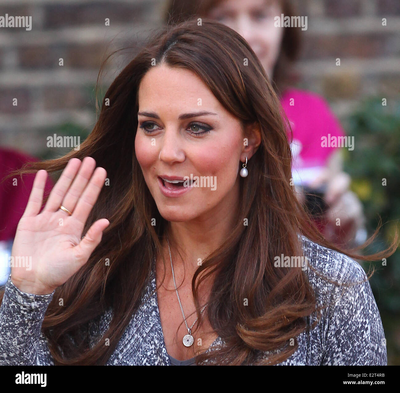 Catherine, Duchess of Cambridge leaves Hope House carrying a bouquet of ...