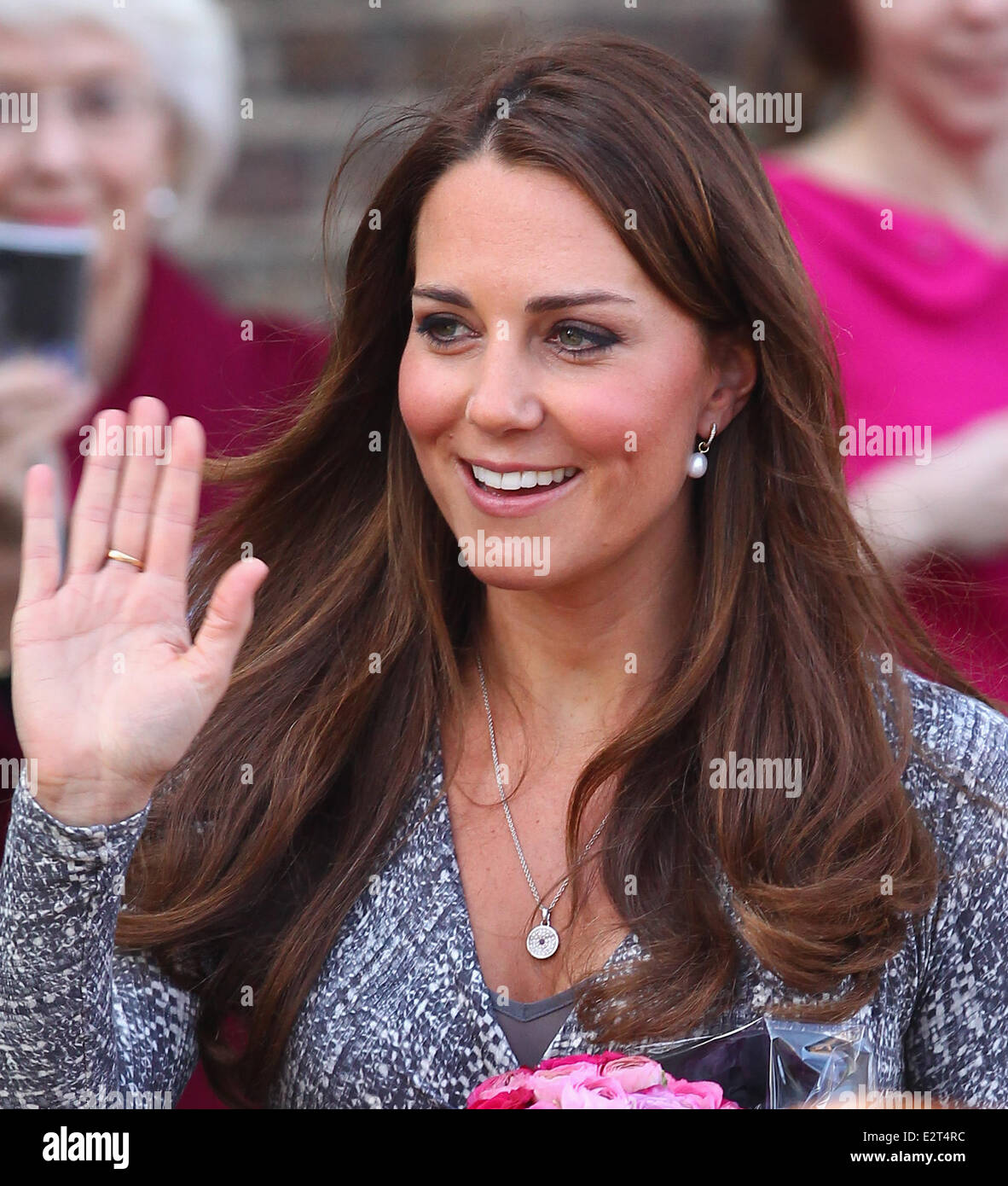 Catherine, Duchess of Cambridge leaves Hope House carrying a bouquet of ...