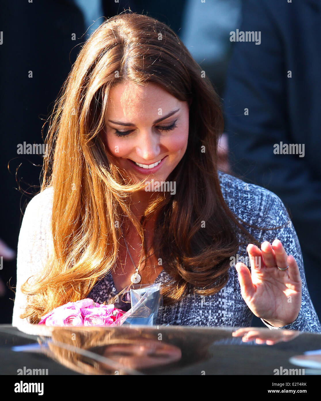 Catherine, Duchess of Cambridge leaves Hope House carrying a bouquet of ...