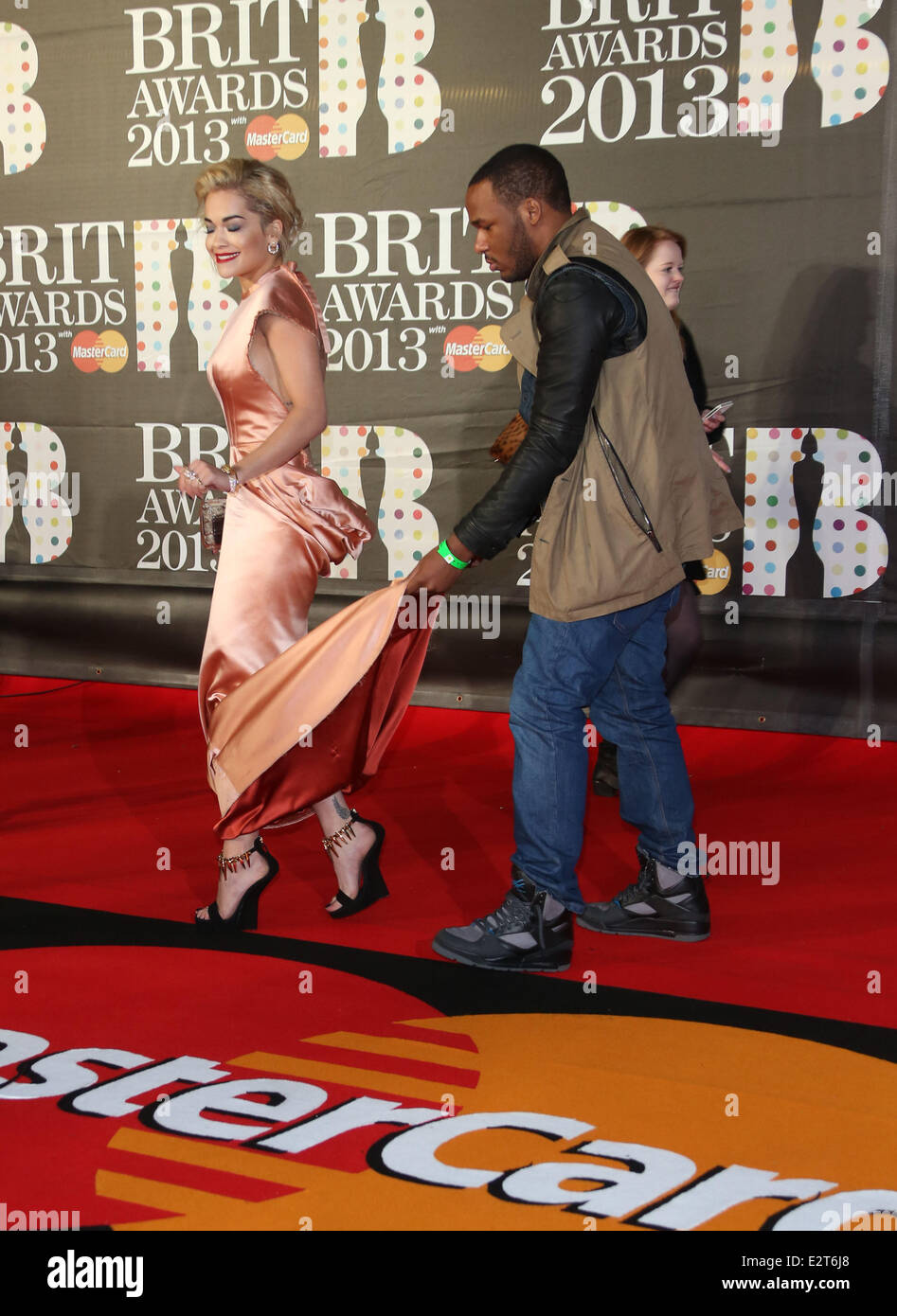 Rita Ora gets a little help with her dress The 2013 Brit Awards (Brits ...