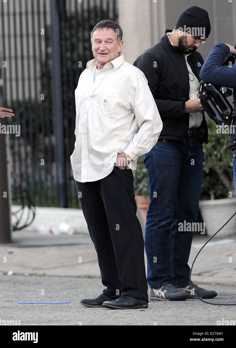Robin Williams cracks a smile during a break in filming on the set of ...