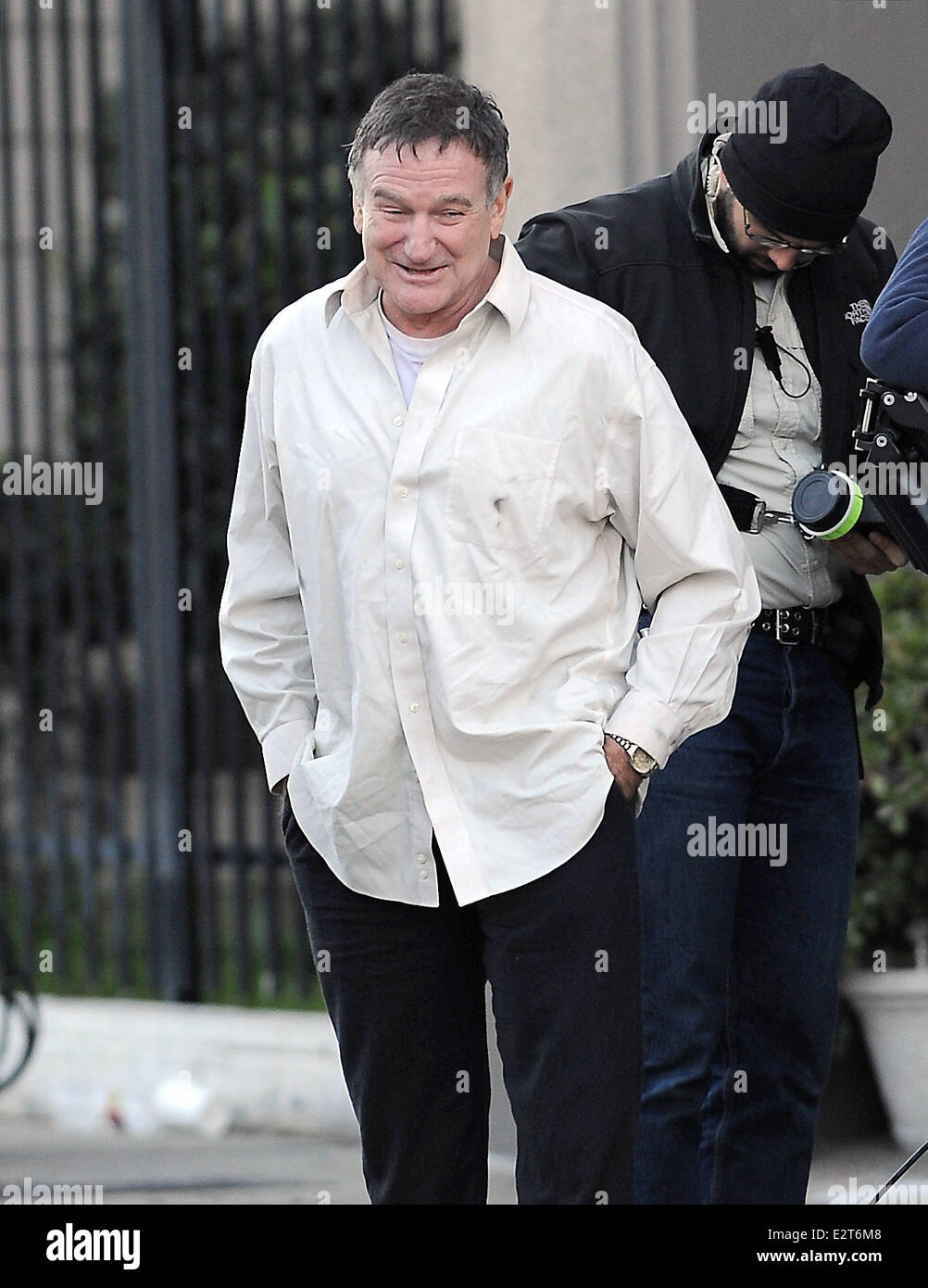 Robin Williams cracks a smile during a break in filming on the set of ...