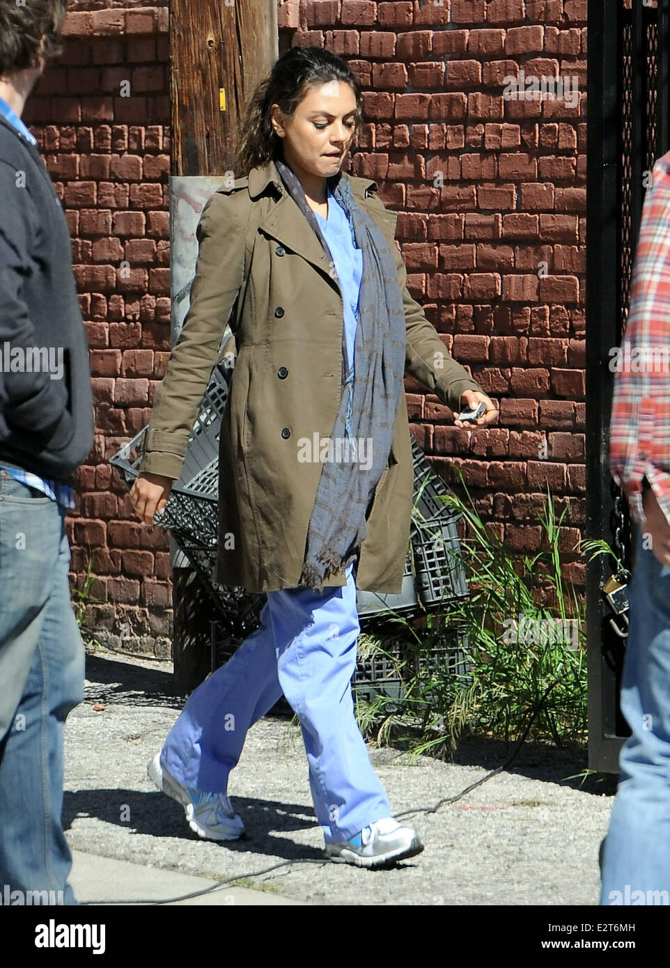 Mila Kunis during a break in filming on the set of 'The Angriest Man in ...