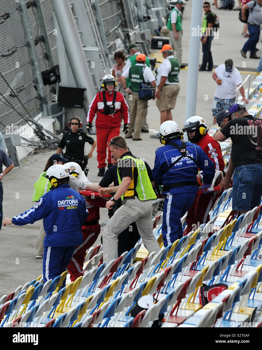 Medical personnel assist fans injured following an incident at the ...