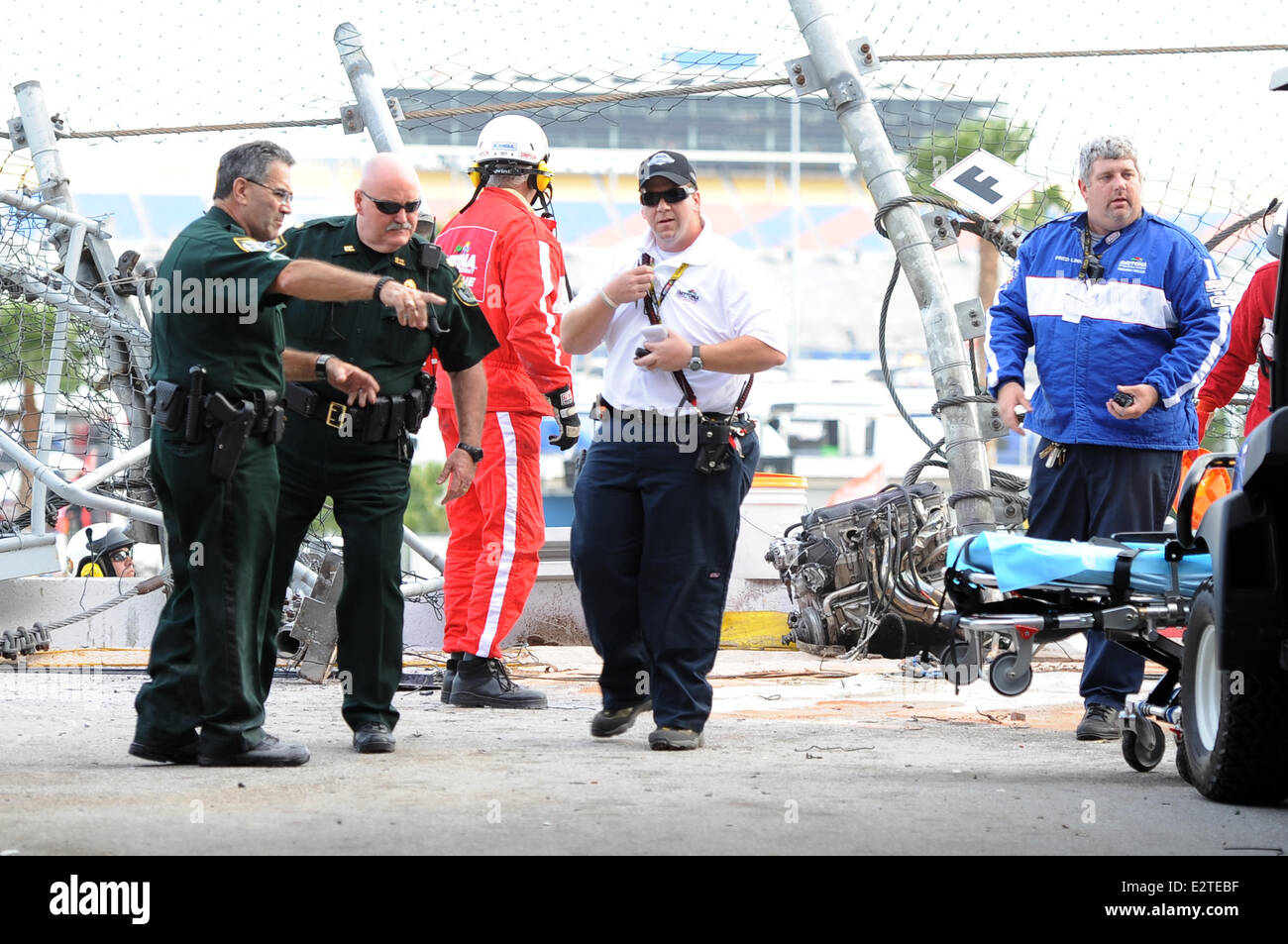 Medical personnel assist fans injured following an incident at the ...