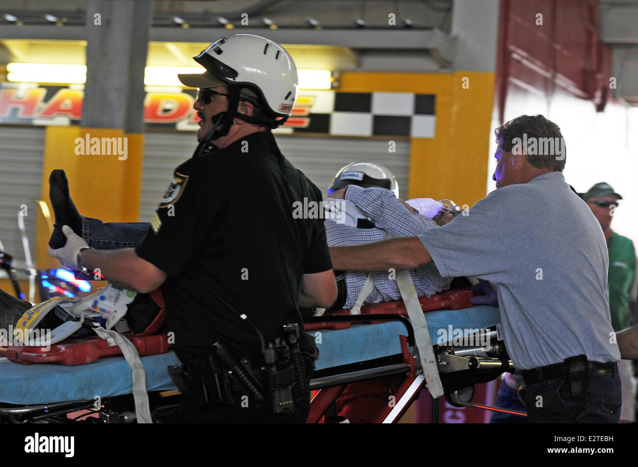 Medical personnel assist fans injured following an incident at the ...