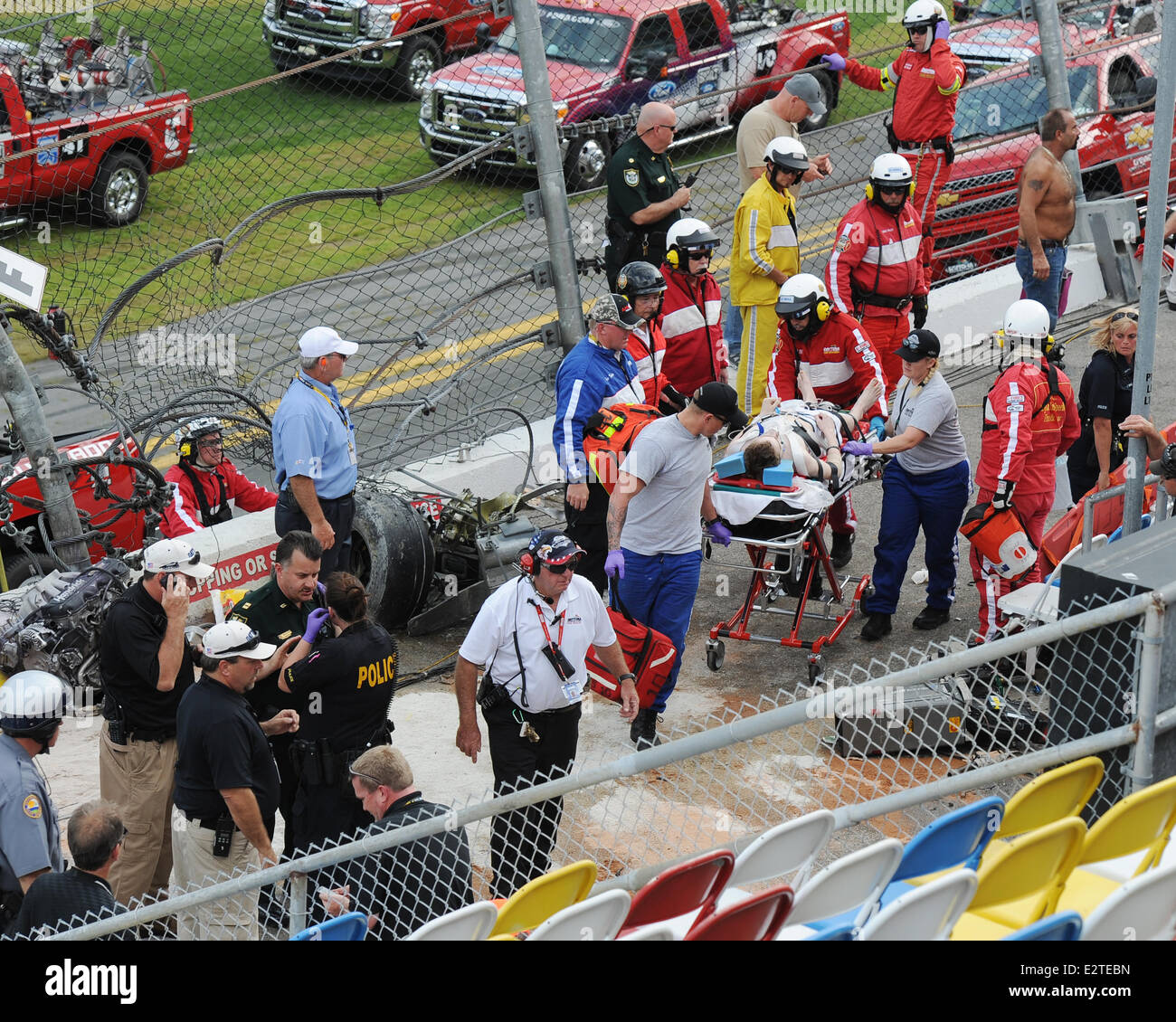 Medical personnel assist fans injured following an incident at the ...
