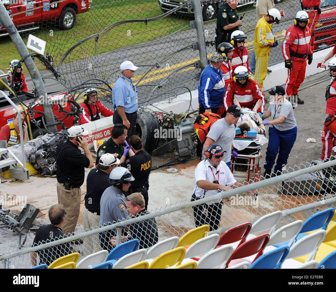 Medical personnel assist fans injured following an incident at the ...