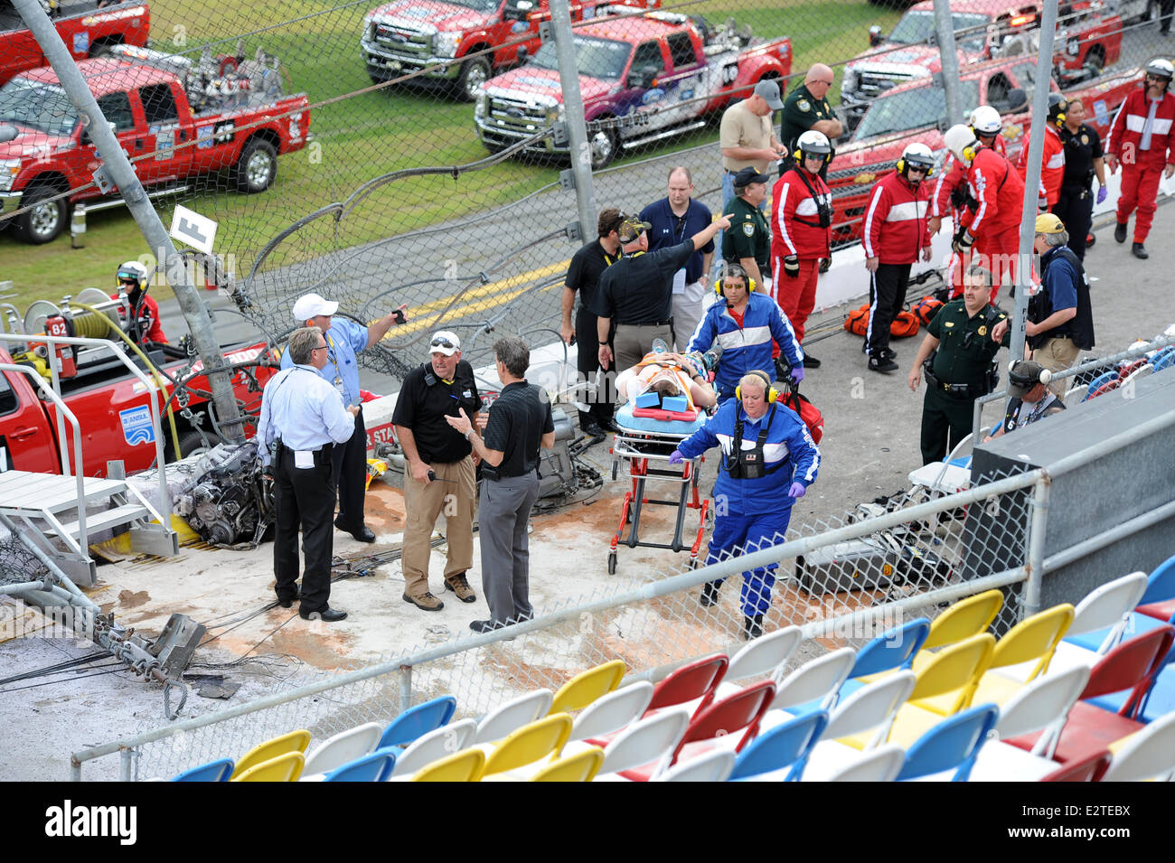 Medical personnel assist fans injured following an incident at the ...