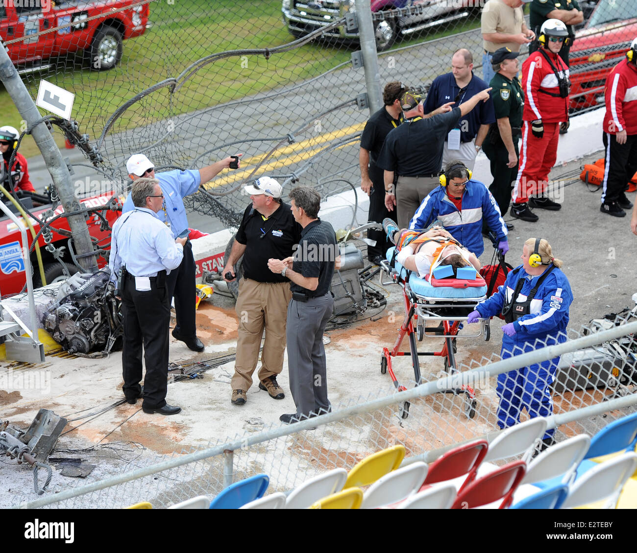 Medical personnel assist fans injured following an incident at the ...