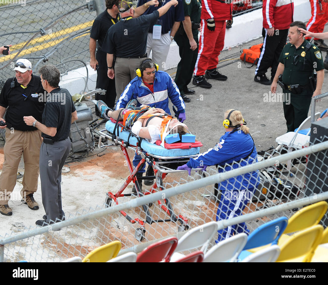 Medical personnel assist fans injured following an incident at the ...