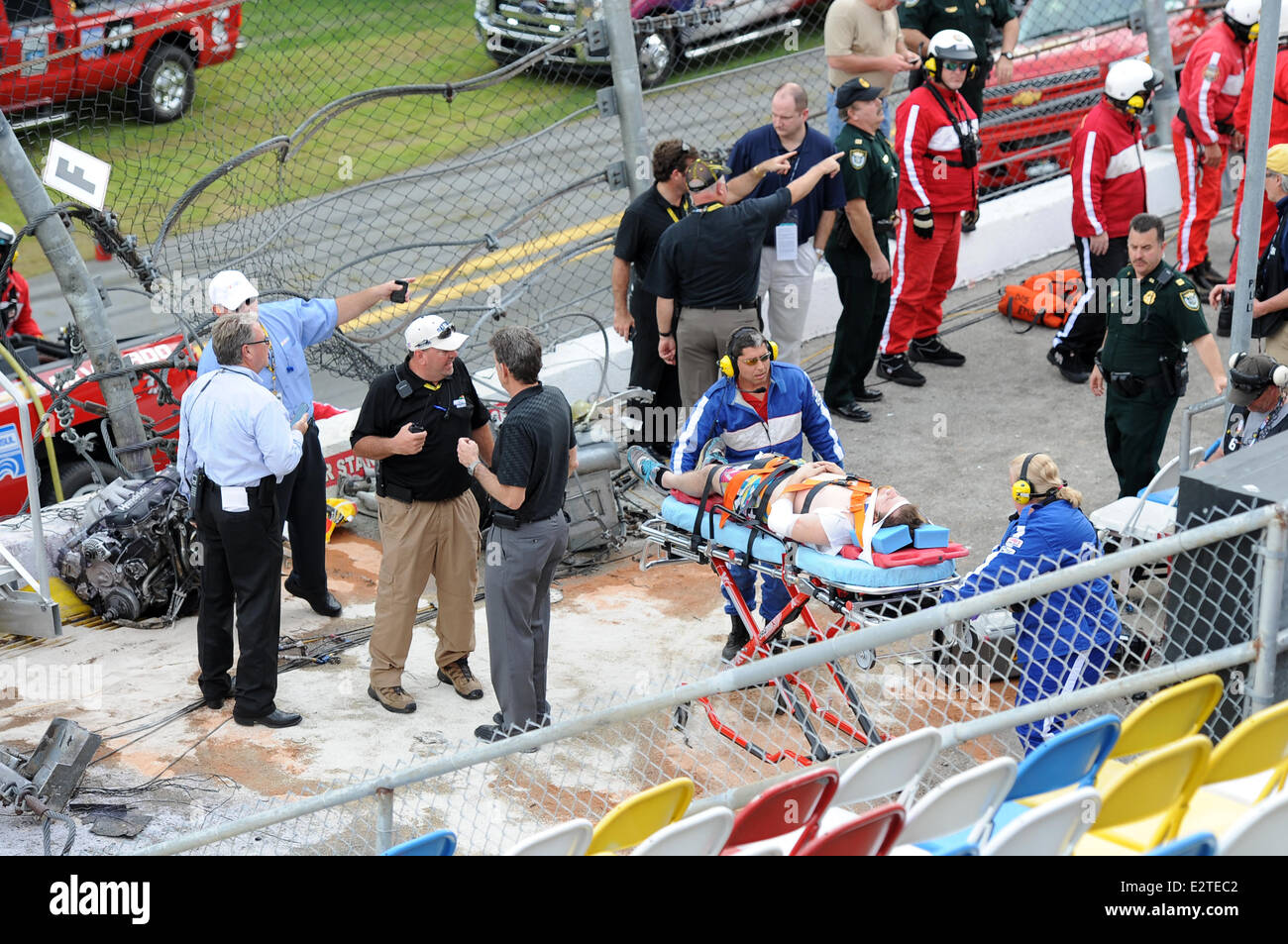 Medical personnel assist fans injured following an incident at the ...