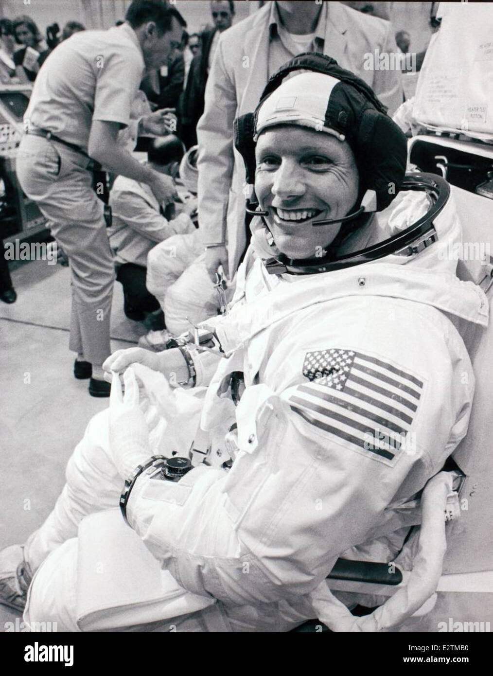 This image shows Neil Armstrong suited up in his space suit, preparing ...