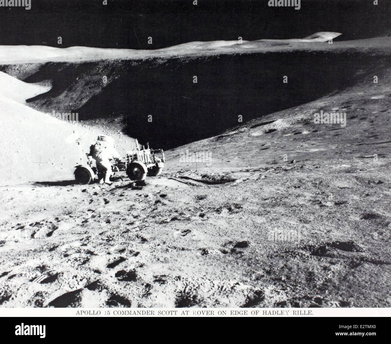 Astronaut David Scott of Apollo 15 is seen next to the Lunar Rover ...