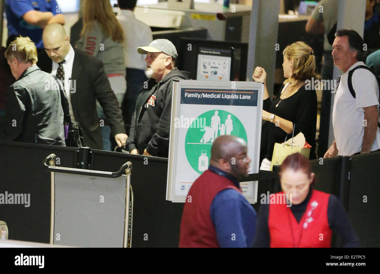 Billy Joel and his wife Alexis Roderick passes through airport security ...