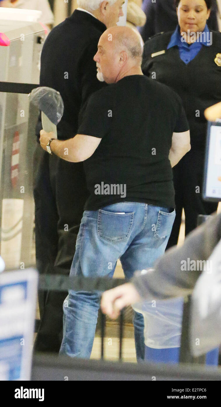 Billy Joel and his wife Alexis Roderick passes through airport security ...