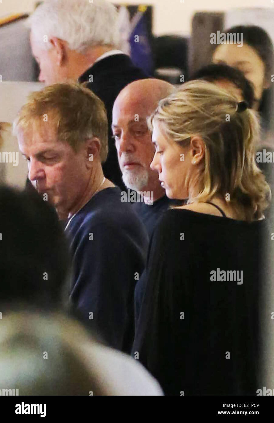 Billy Joel and his wife Alexis Roderick passes through airport security ...