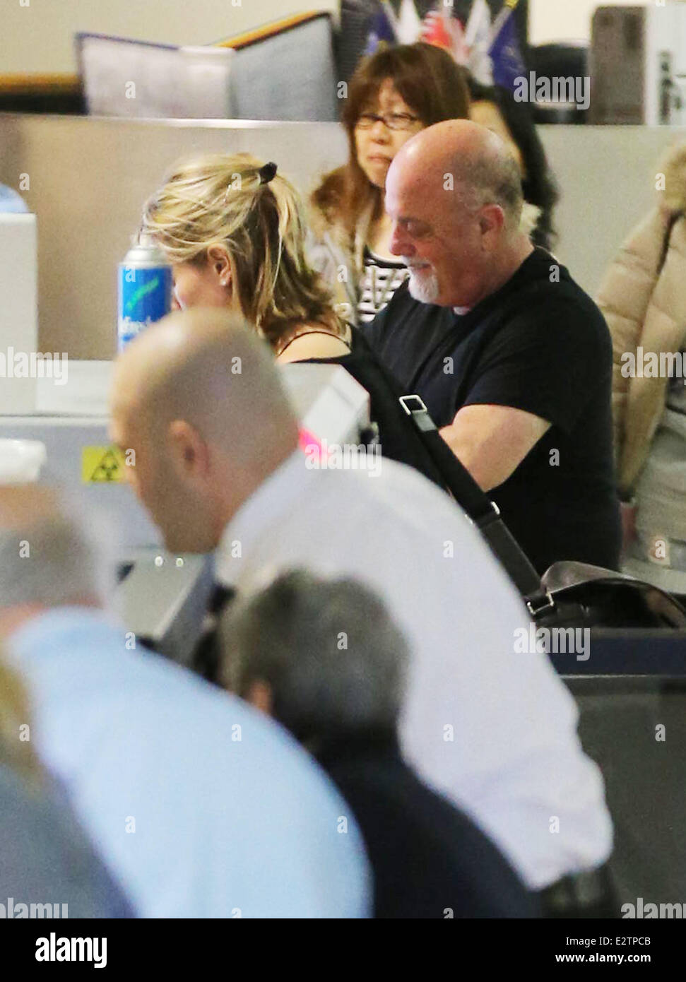 Billy Joel and his wife Alexis Roderick passes through airport security ...