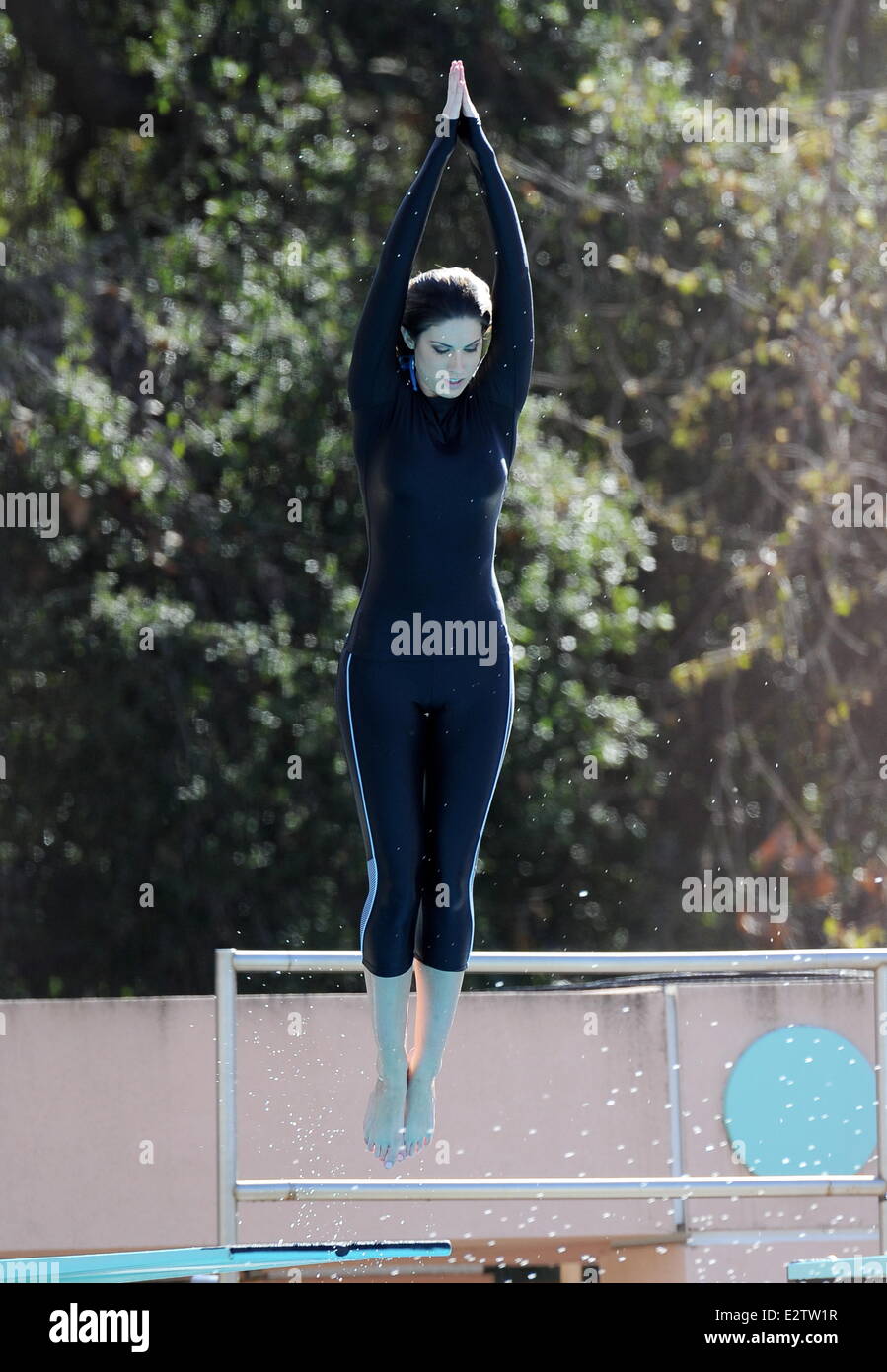 Katherine Webb seen stretching out before practicing her diving ...