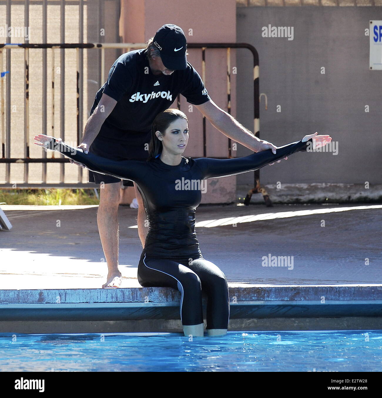 Katherine Webb seen stretching out before practicing her diving ...