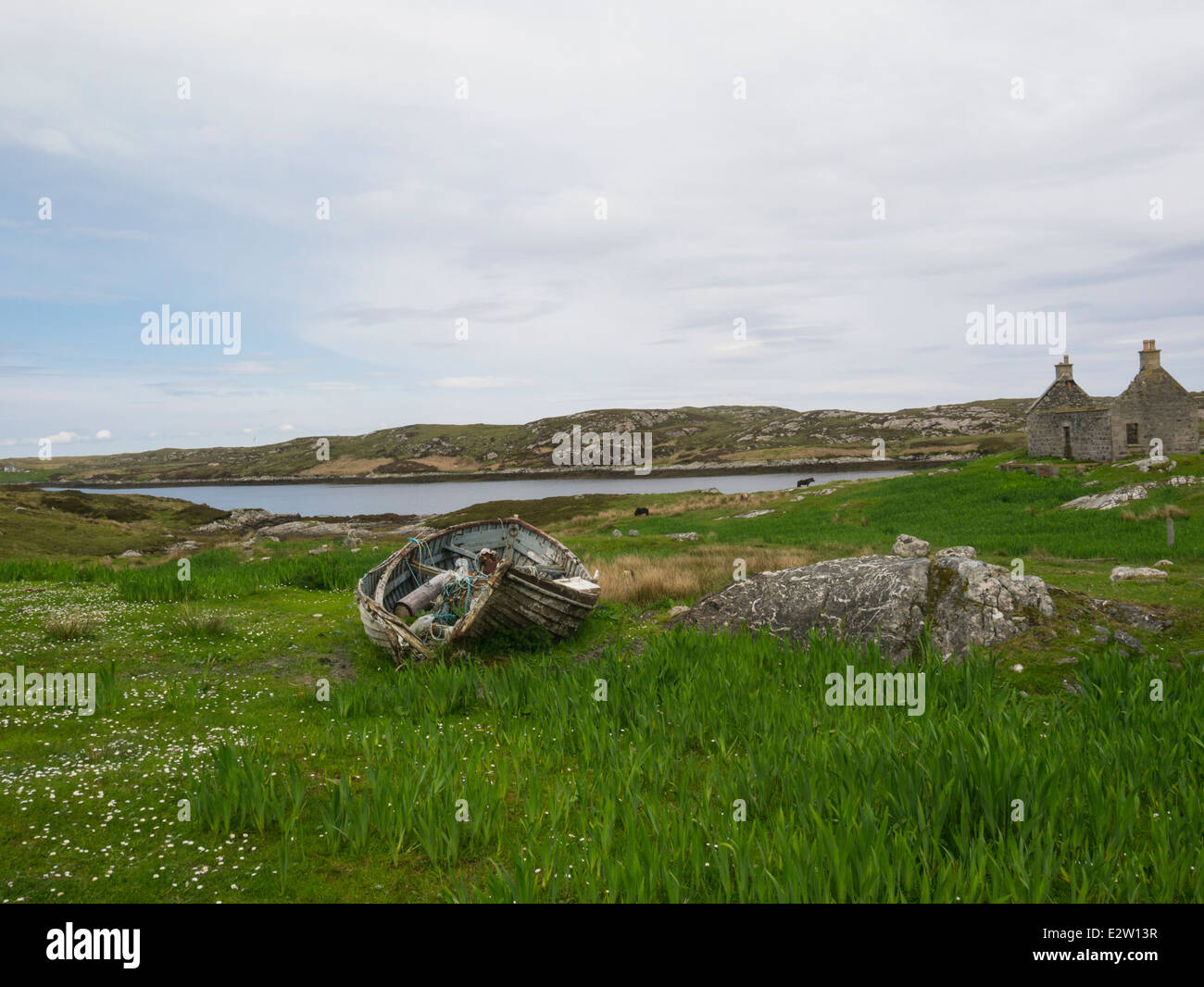 Abandoned boat and ruined croft at Loch Sgioport South Uist Outer ...