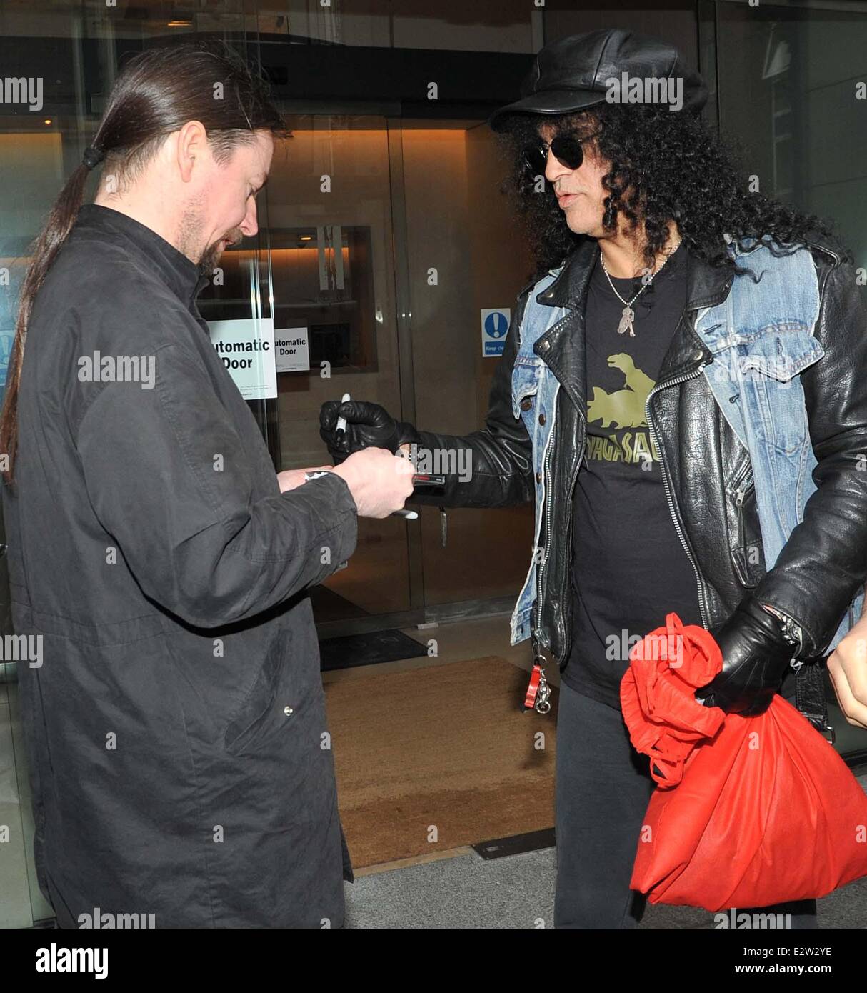 Guitarist Slash is seen greeting fans outside the Morrison Hotel in ...