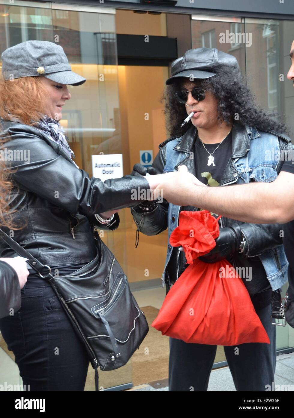 Slash meets with his fans outside The Morrison Hotel Featuring: Slash ...