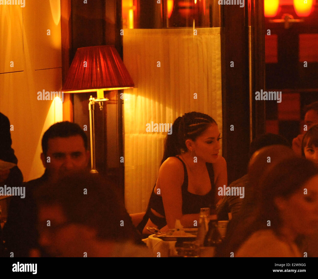 Nicole Scherzinger dining late at a table inside C London restaurant ...