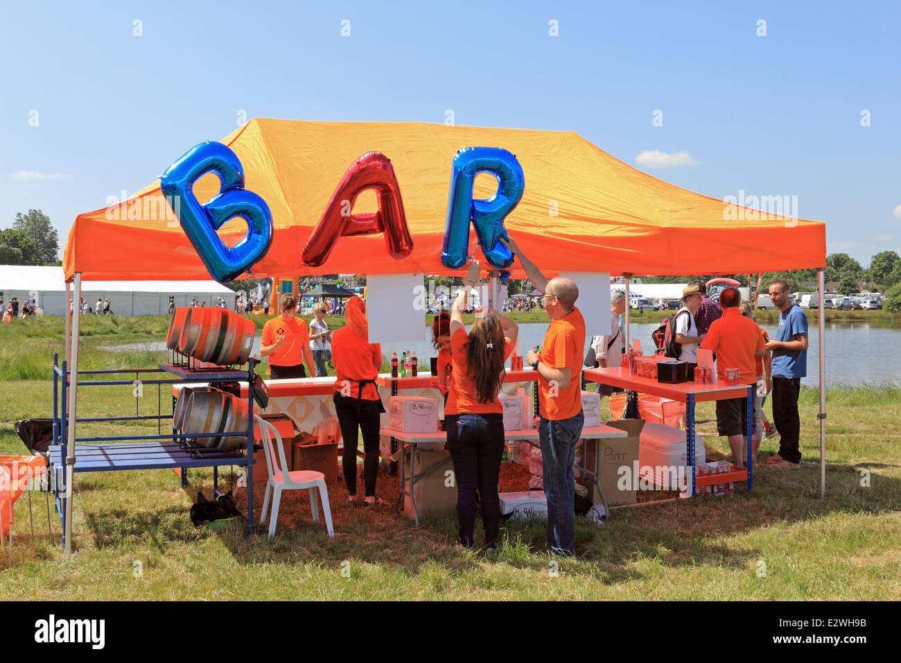 Wimbledon Common, London SW19 UK. 21st June 2014. Manning the bar at ...