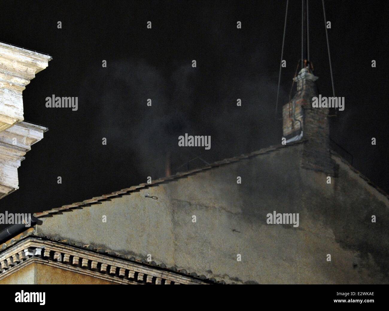 Black smoke billows out from the chimney on the roof of the Sistine ...