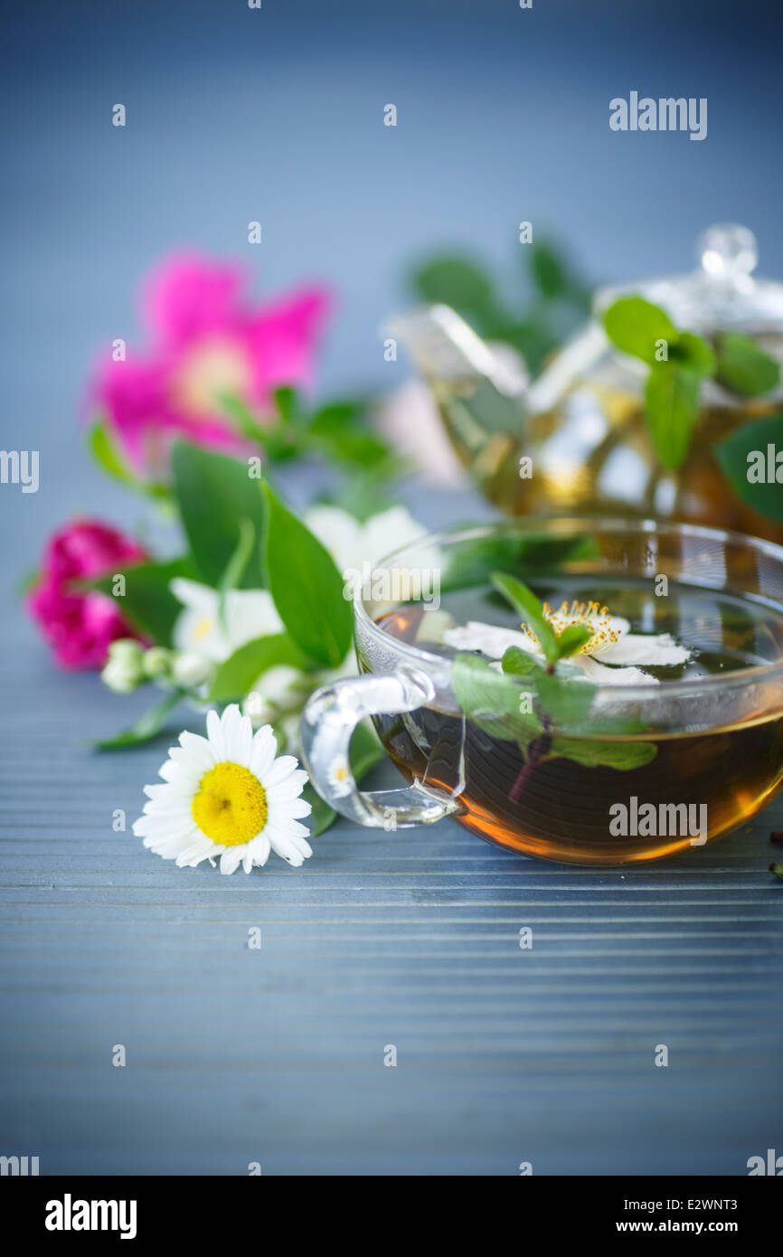 flower tea of different flowers in a teapot on the table Stock Photo ...